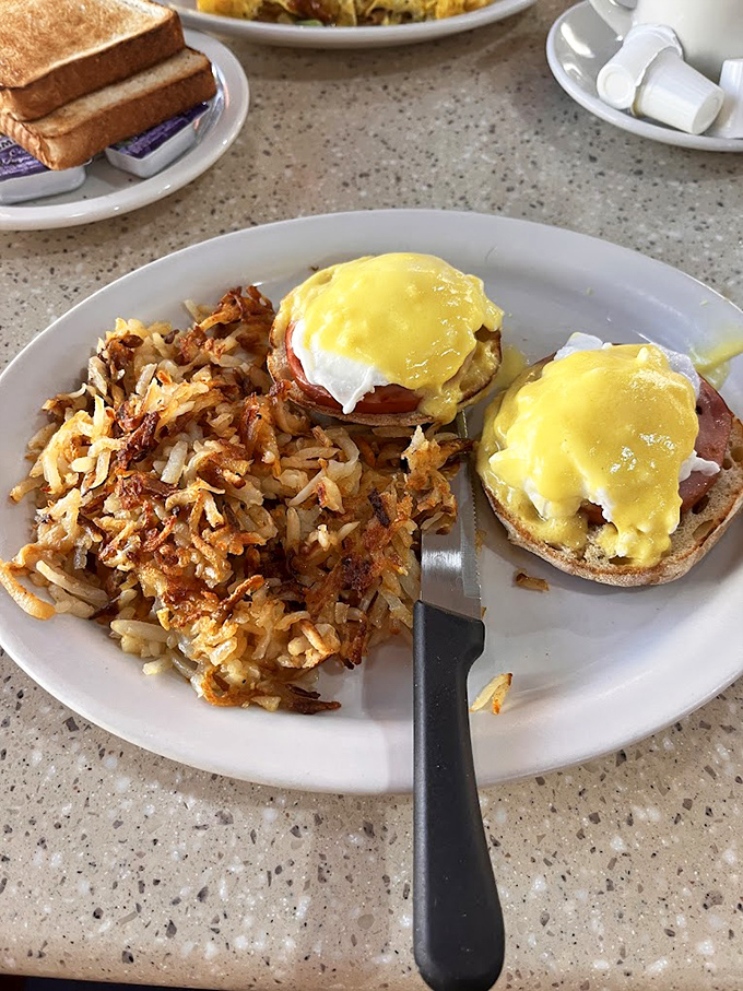 Behold the star of our show: Eggs Benedict with perfectly crispy home fries. That hollandaise sauce should have its own Instagram account.