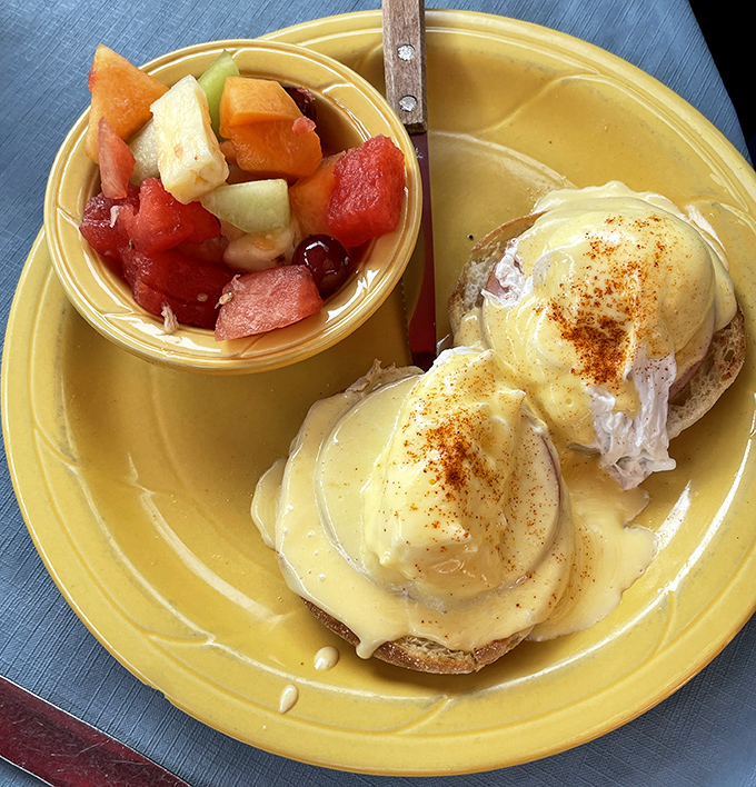 Eggs Benedict perfection: Two golden-domed poached eggs nestled on English muffins, blanketed in hollandaise that's worth crossing state lines for.