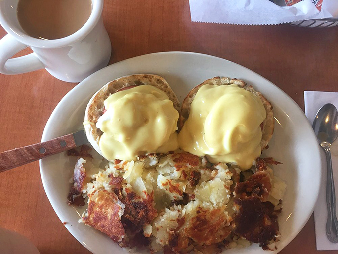 Behold the holy grail of breakfast &ndash; Eggs Benedict with hollandaise so rich it should have its own tax bracket, alongside crispy home fries.