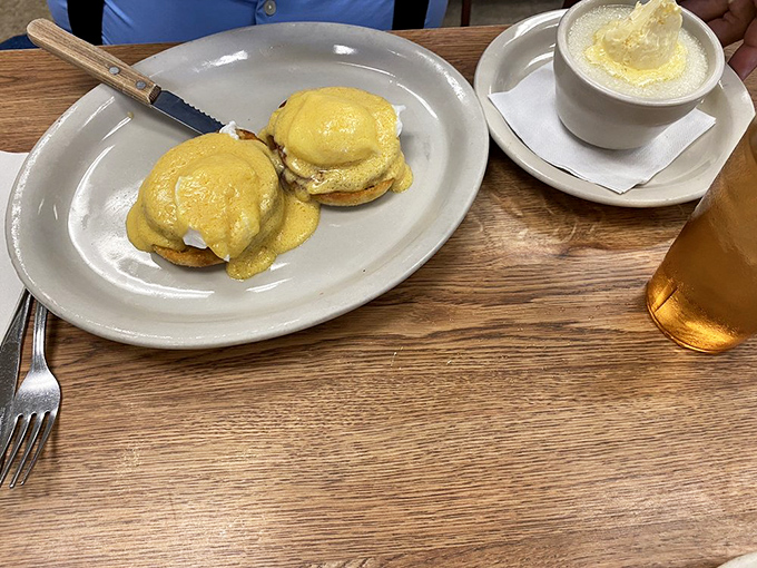 Eggs Benedict that would make a French chef weep with joy. That hollandaise sauce looks like liquid sunshine cascading over perfectly poached eggs.