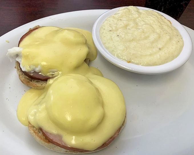 Behold the eggs Benedict in all its golden glory! That hollandaise sauce cascades like a buttery waterfall that would make Julia Child slow-clap in approval.