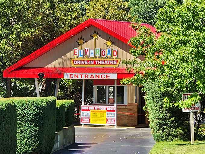 The charming entrance booth welcomes moviegoers with its distinctive red roof and yellow stars. First stop on your journey to cinematic bliss.