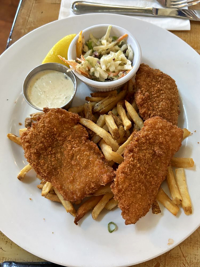 The star of the show: golden-battered fish and chips that crackle with each bite, served with slaw that's actually worth eating.