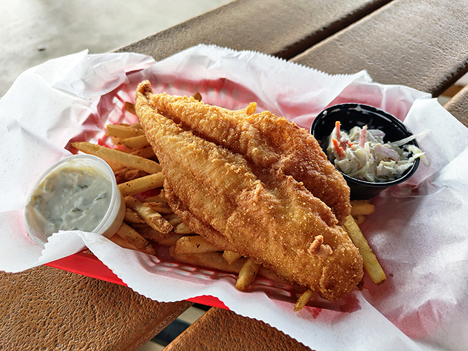 Fish and chips that would make a British pub jealous. The golden batter shatters with each bite, revealing flaky white fish that tastes like vacation.