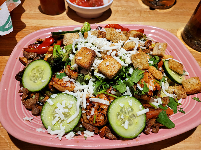A fiesta on a plate! This colorful fajita salad brings together crisp vegetables, perfectly seasoned protein, and crunchy tortilla strips in harmonious balance.