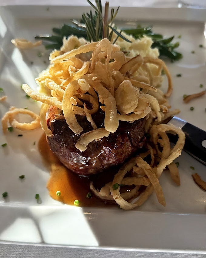 The star of the show: a perfectly seared filet mignon crowned with crispy onion straws. Meat perfection that melts like butter.