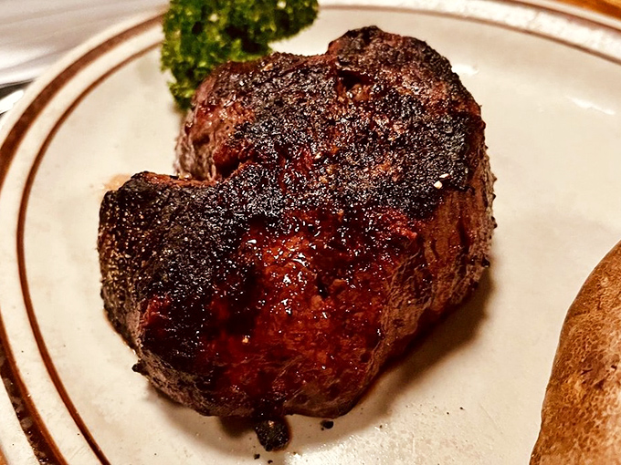 This isn't just a filet mignon—it's a masterpiece of meat chemistry, with a perfectly caramelized crust giving way to a tender interior that practically melts on contact.