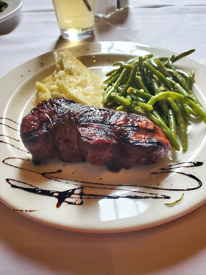 This filet mignon isn't just a steak; it's a masterclass in simplicity—perfectly seared, artfully plated, and ready to make you question every other steak you've ever loved.