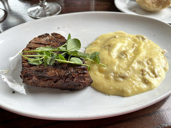 Behold the star attraction&mdash;a perfectly seared filet mignon alongside creamy mashed potatoes. This isn't just dinner; it's a religious experience.