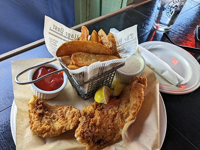 Golden-battered fish that shatters at first bite, paired with hand-cut fries that could make a British pub jealous. This is seafood nirvana.