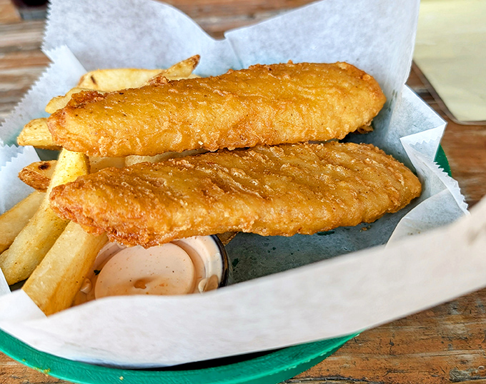 Golden-battered fish that shatters with each bite, paired with chips that achieve the perfect balance between crisp exterior and fluffy heart.