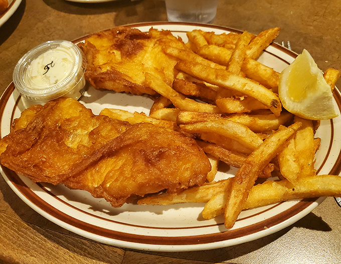 Behold the golden standard: fish and chips that would make any coastal town jealous. 