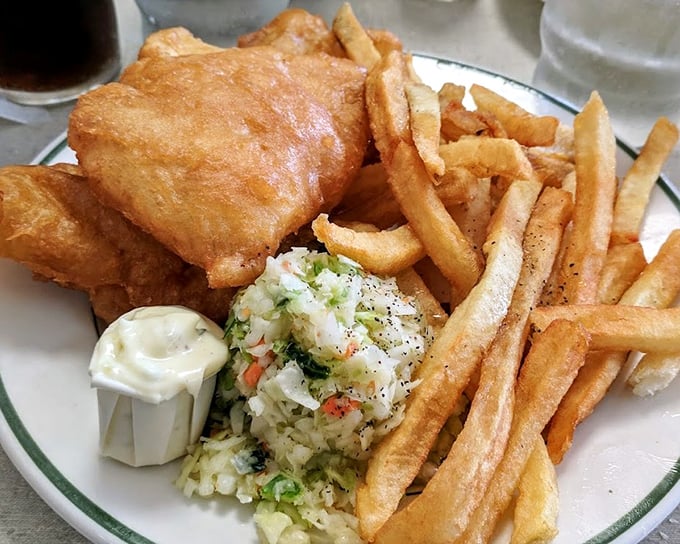 Golden-battered cod, crispy fries, and fresh coleslaw &ndash; the holy trinity of comfort food that's kept Detroiters coming back for generations.