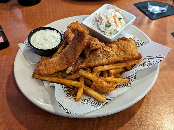 The holy trinity of fish and chips: golden-battered haddock, perfectly crisp fries, and house-made tartar sauce. Comfort food that speaks a universal language.