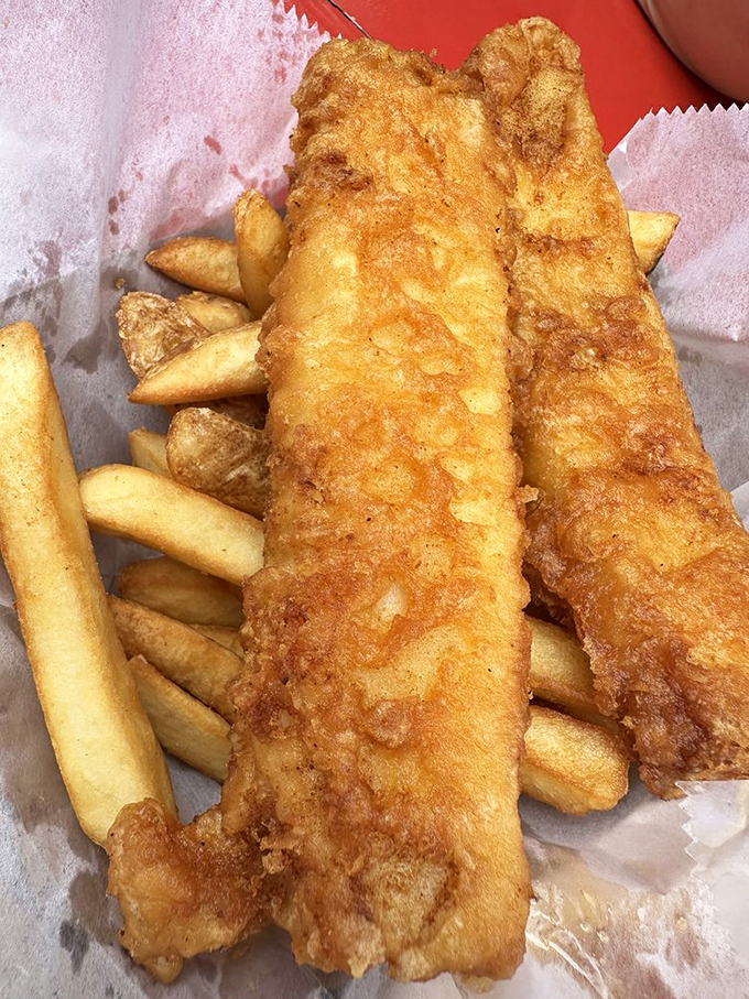 Golden, crispy perfection that makes you forget your table manners. These fish and chips aren't just a meal &ndash; they're an edible love letter to the ocean.