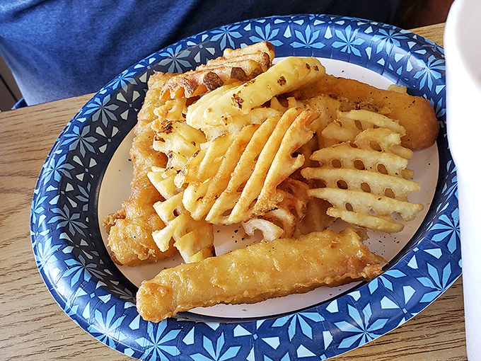 Golden-battered fish that shatters like glass alongside waffle fries that could make a potato proud. The ocean never had it so good.