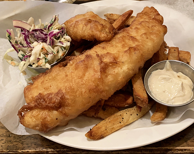 Golden, crispy, and substantial enough to require a building permit &ndash; this fish and chips comes with slaw that isn't an afterthought but a worthy companion.