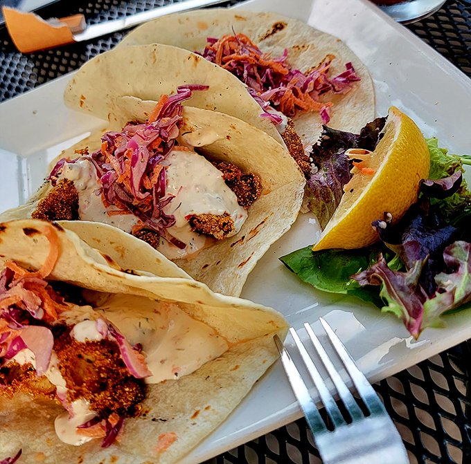 Behold the legendary fish fry tacos! Cornmeal-crusted perch nestled in flour tortillas with that vibrant slaw &ndash; Wisconsin tradition gets a brilliant makeover.