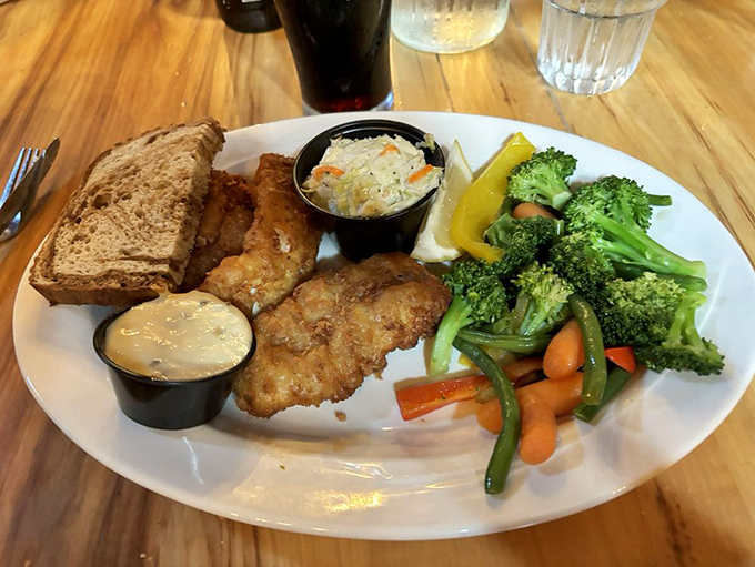 Wisconsin's fish fry tradition reaches its golden-battered zenith here, served with vegetables that didn't travel farther than you did.