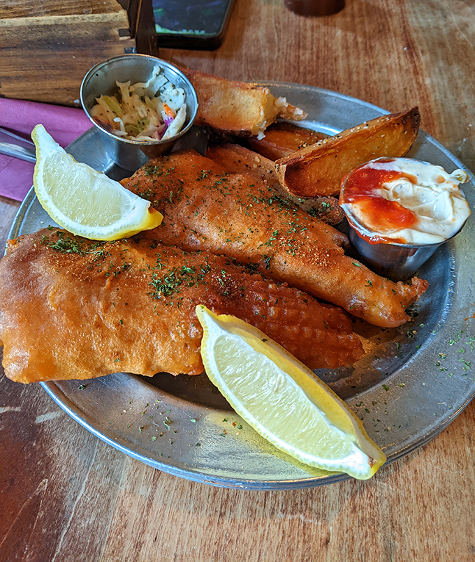 The fish and chips that launched a thousand return visits. Golden, crispy batter protecting flaky cod like armor, with chips that could make a British expat weep with joy.