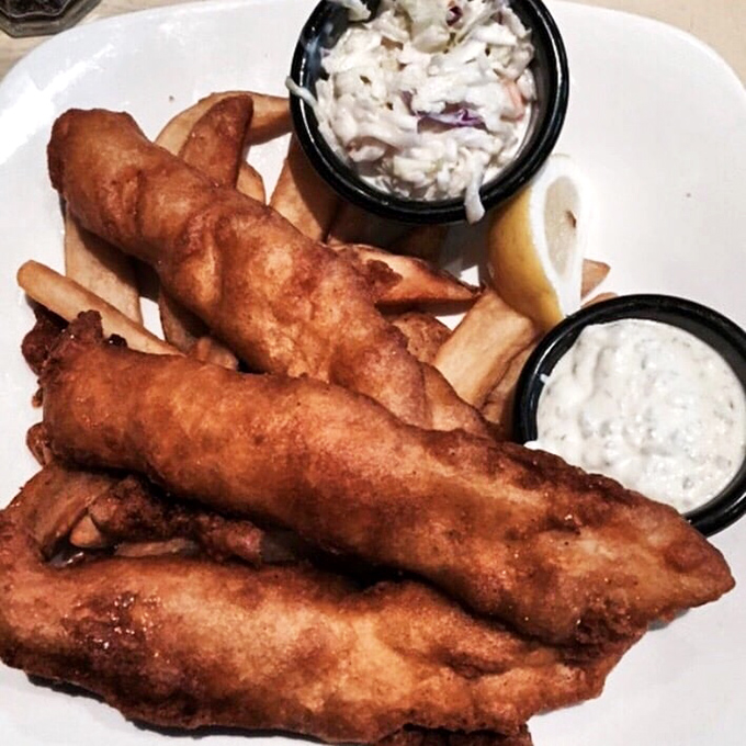 Golden-battered fish that shatters with each bite, paired with fries that deserve their own fan club. This isn't just fish and chips&mdash;it's edible poetry.