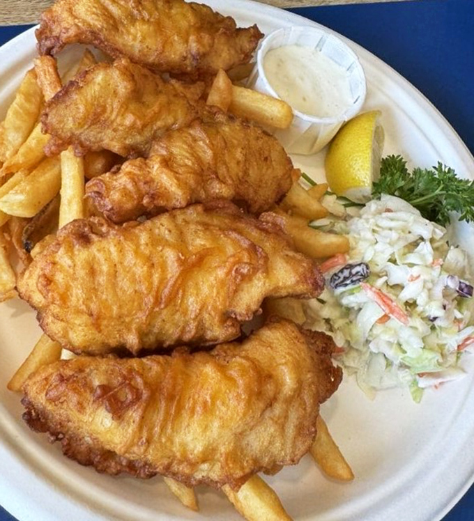 Golden-battered fish that shatters with each bite, alongside fries that actually taste like potato. This isn't just food&mdash;it's edible sunshine from the Pacific.