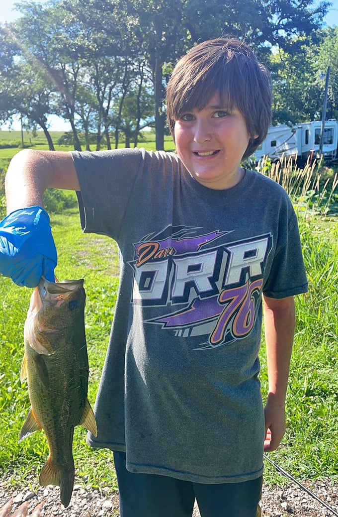 Nothing says "Iowa summer" quite like a proud young angler showing off the day's catch at Lake Icaria.