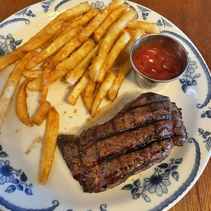 The star of the show: a perfectly seared flat iron steak with those textbook grill marks. Those golden fries aren't just sidekicks&mdash;they're worthy companions.