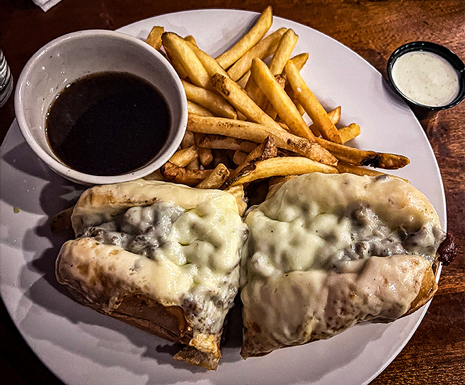 The legendary French Dip in its natural habitat &ndash; swimming alongside golden fries with that magical cup of au jus waiting for its dipping destiny.