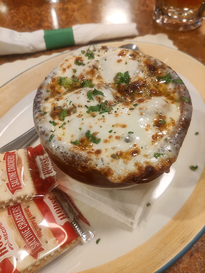 Behold the crown jewel: French onion soup with a golden dome of perfectly broiled cheese that stretches like a gymnast when you dig in.