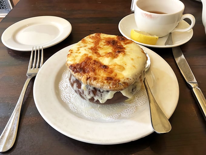 The legendary French onion soup that launches a thousand detours. That cheese pull deserves its own Instagram account and possibly a talent agent.