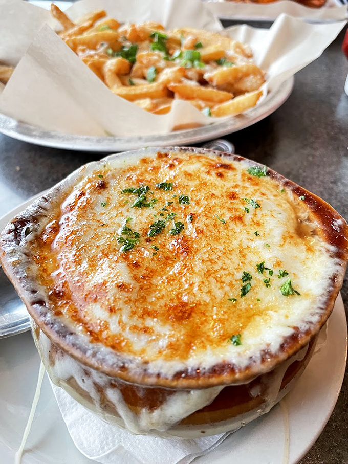 Behold the French onion soup in all its glory&mdash;that cheese pull could win Olympic medals, while the broth beneath deserves its own hall of fame.