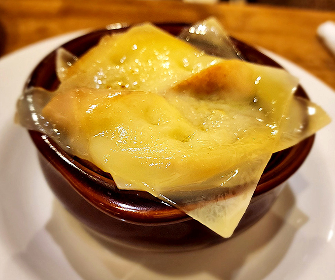 Behold the star attraction: French onion soup that's worth crossing county lines for, with melted Gruy&egrave;re cascading over house-made baguette like a cheese avalanche of joy.