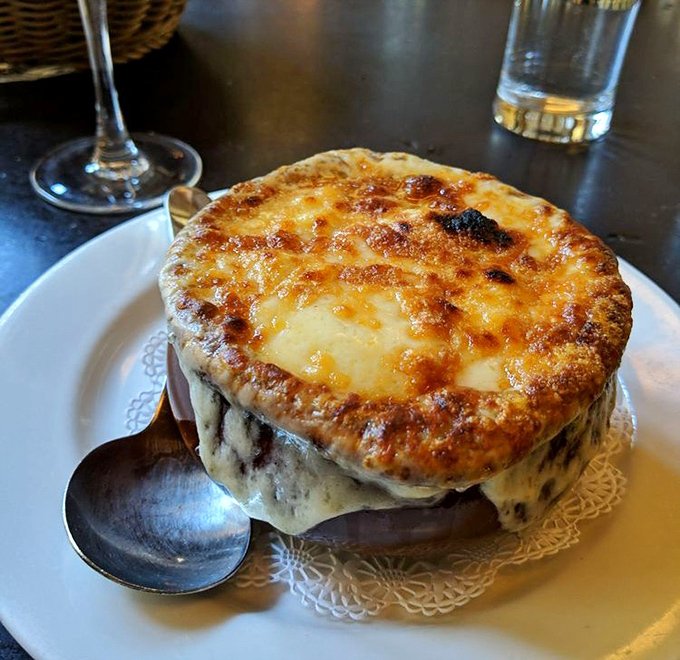 Behold the star attraction: French onion soup with a cheese cap so perfectly bronzed, it deserves its own spot in the culinary hall of fame.