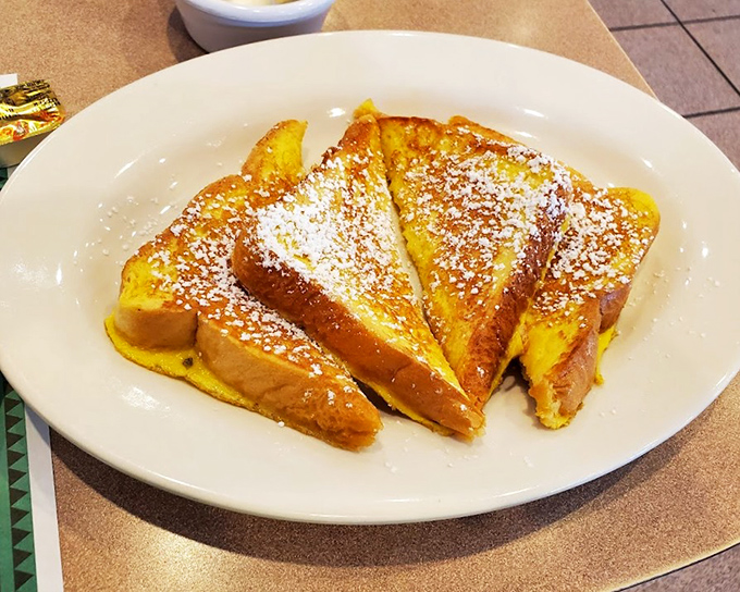 French toast that's achieved celebrity status in my carb dreams&mdash;golden, crispy edges giving way to custardy centers dusted with powdered sugar.