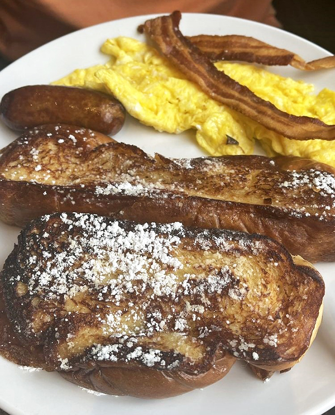 Golden-brown perfection dusted with powdered sugar &ndash; this french toast isn't just breakfast, it's a morning masterpiece worthy of your stretchy pants.