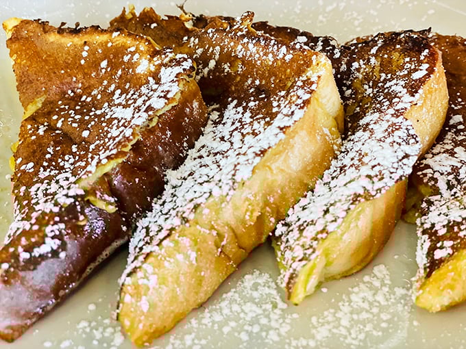 Behold the French toast that launched a thousand food pilgrimages&mdash;golden, custard-soaked perfection dusted with powdered sugar.