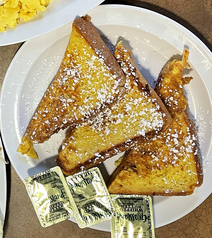 This French toast isn't just breakfast &ndash; it's a powdered sugar-dusted revelation that makes you wonder why you'd ever settle for lesser versions.