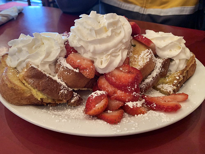 Strawberry French toast that makes time stand still&mdash;golden bread islands in a sea of berries, crowned with whipped cream mountains that melt into sweet oblivion.