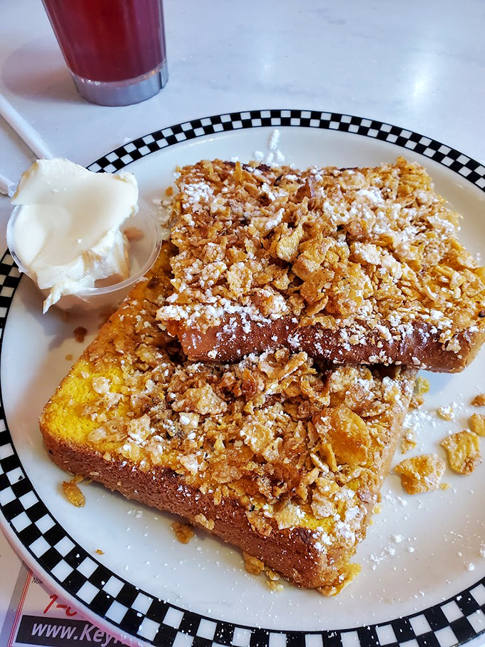 This isn't just French toast&mdash;it's a crunchy, custardy masterpiece crowned with cornflake crumbles and powdered sugar confetti.