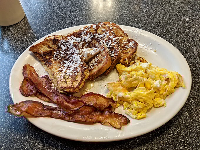 French toast that's achieved that mythical balance&mdash;crispy exterior, custardy interior&mdash;paired with eggs and bacon that know their supporting roles perfectly.