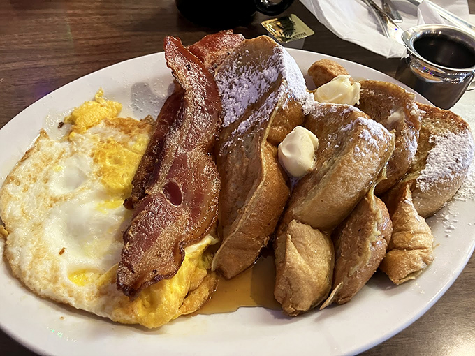 French toast that makes you question every other breakfast you've ever had – with bacon standing guard to ensure nothing comes between you and bliss.