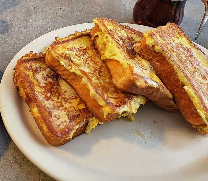 Behold: The French toast that launched a thousand food dreams. Golden, custardy perfection that makes you wonder why you'd ever eat anything else.