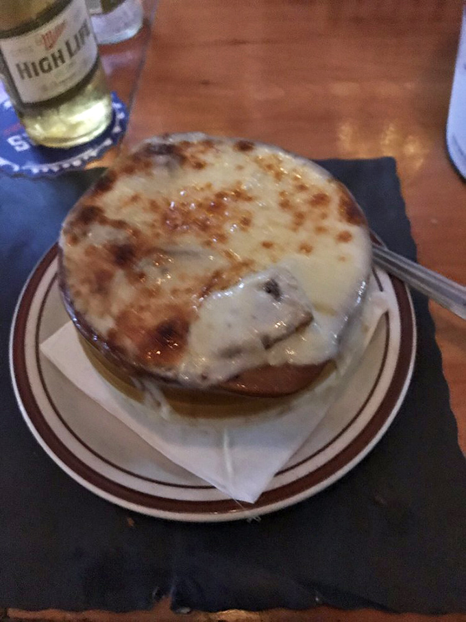 Behold the crown jewel: French onion soup with a cheese cap so perfectly browned, it deserves its own Philadelphia mural.