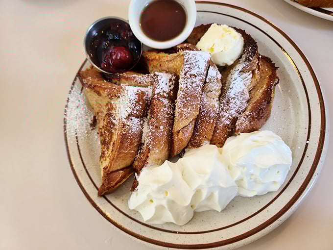 French toast that's dressed for success&mdash;powdered sugar, fresh berries, and enough whipped cream to make your cardiologist wince. Worth it.