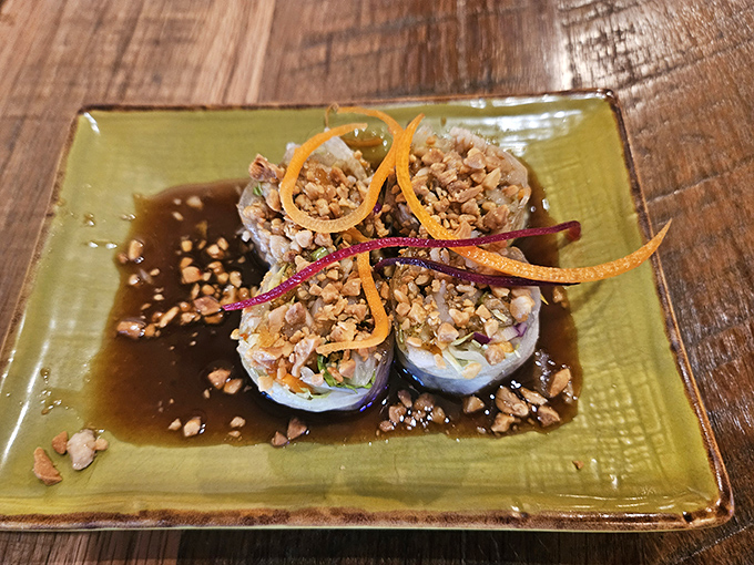 These fresh spring rolls aren't just appetizers&mdash;they're edible art, topped with crushed peanuts and colorful garnishes that dance on your taste buds.