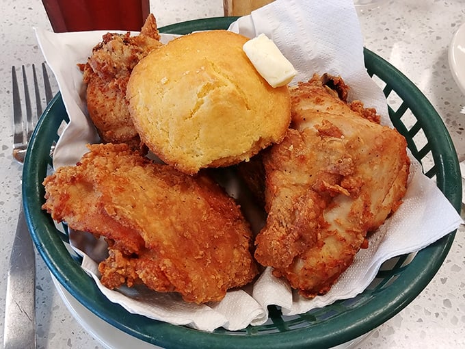 Golden-brown perfection on a plate&mdash;crispy chicken nestled beside a buttery cornbread muffin that's begging to be devoured.