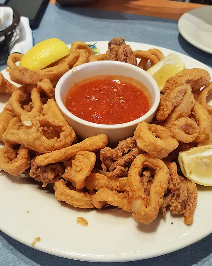 Golden-fried perfection in every bite. This calamari isn't just cooked—it's been elevated to an art form, with marinara sauce as its perfect companion.
