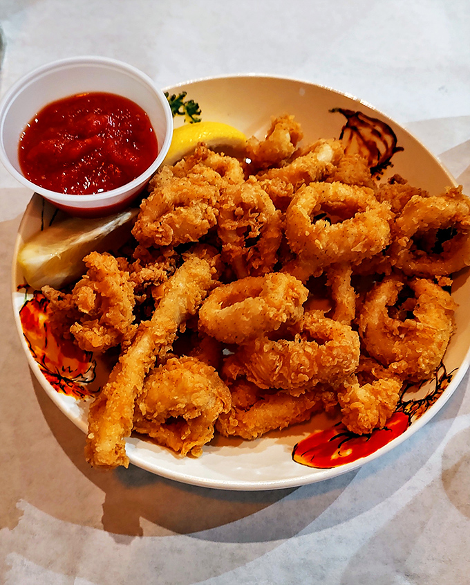 Golden, crispy perfection! This calamari achieves the holy grail of seafood frying—tender squid encased in a light, crunchy coating that shatters with each bite.