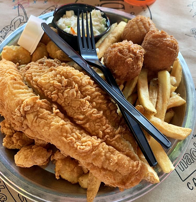 Golden-battered catfish that shatters with each bite, revealing pearly white flesh beneath. This isn't just fried fish &ndash; it's edible Southern poetry.